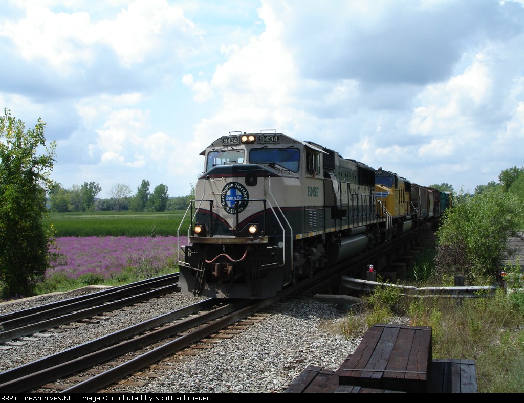 BNSF 9434 & UP 4080 lead a mixed freight past the Trestle EB